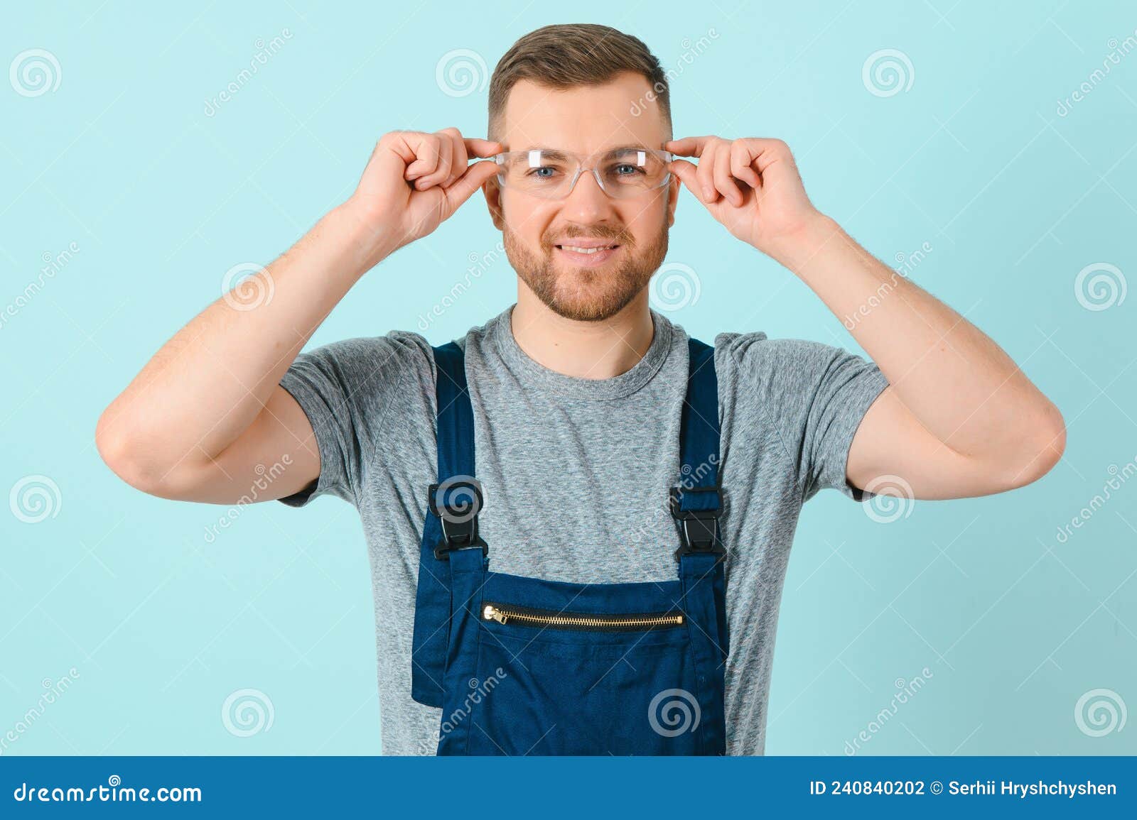 Handsome Young Craftsman Over Isolated Blue Background Stock Photo ...