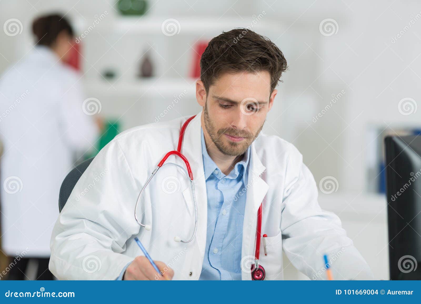 Handsome Young Doctor at Work in Office Stock Photo - Image of ...