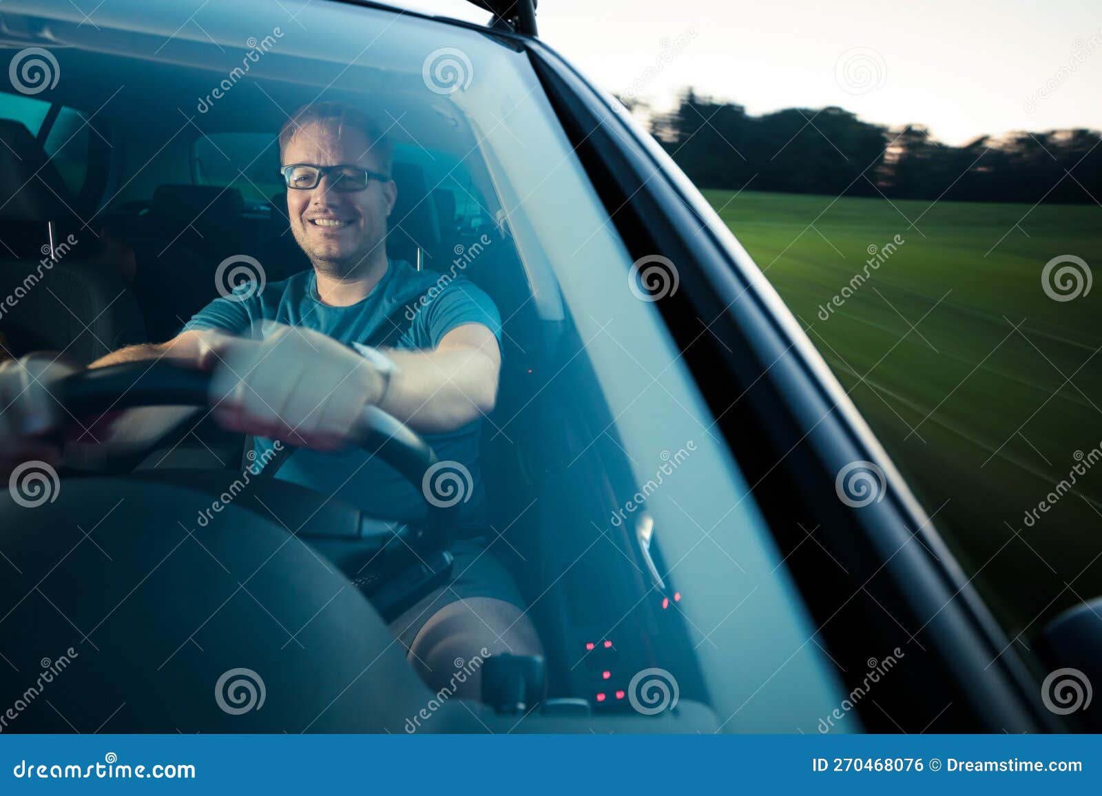 Handsome Young Driver Driving Hic Car Fast yet Safely on the Road Stock ...