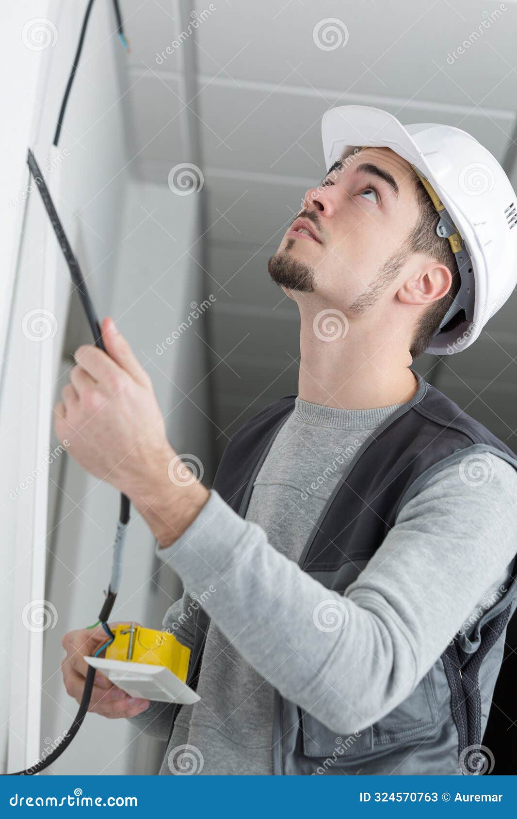 Handsome Young Electrician Working at Construction Site Stock Image ...