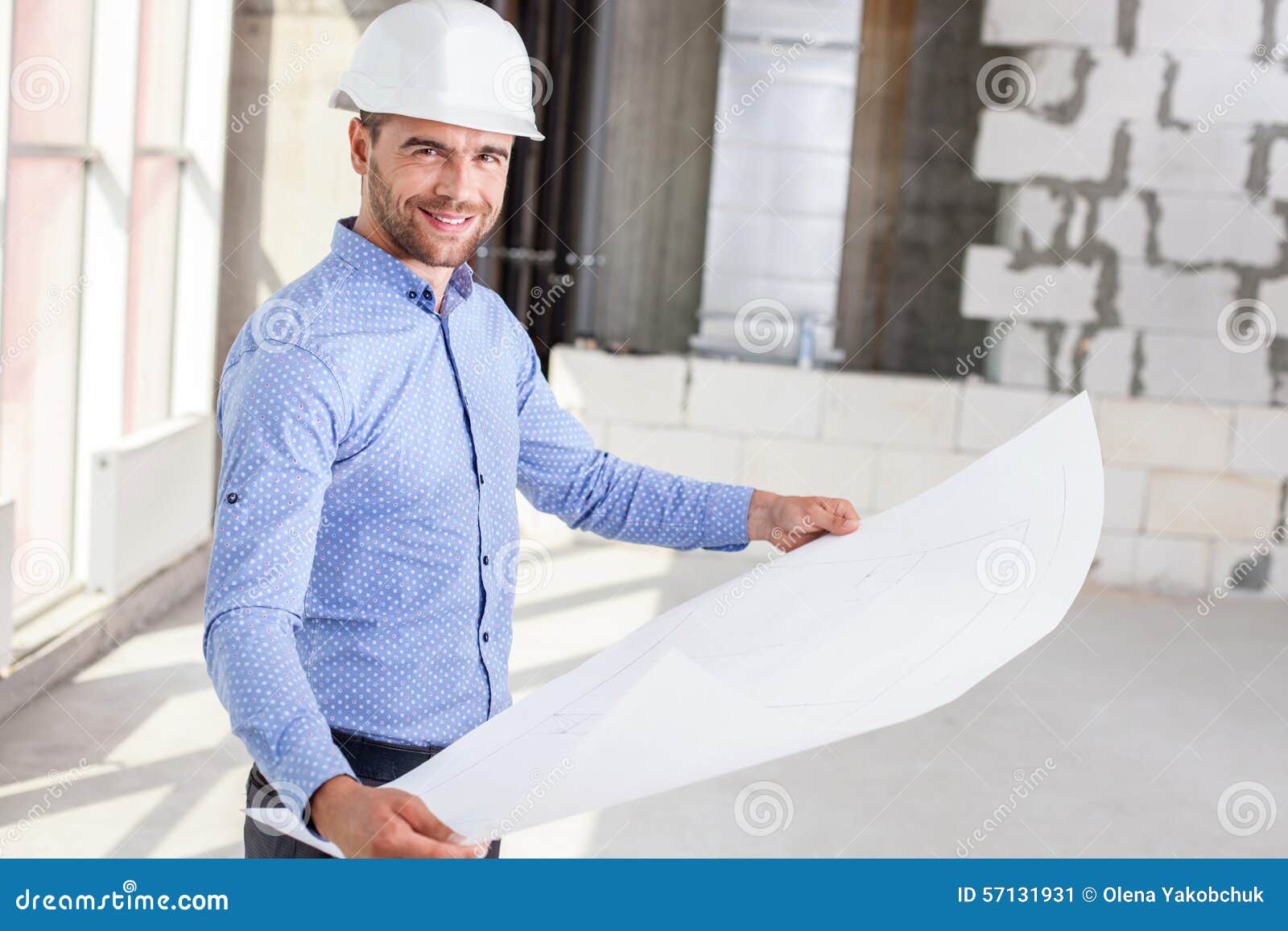 Handsome Young Engineer is Analyzing the Plan of a Stock Image - Image ...