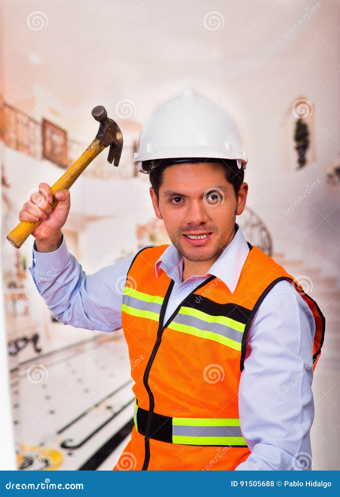 Handsome Young Engineer Holding a Hammer in His Hand at Construction ...