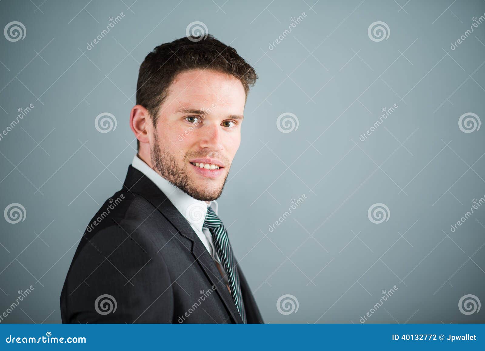 Handsome Young Executive Business Man Isolated on Grey Background Stock ...