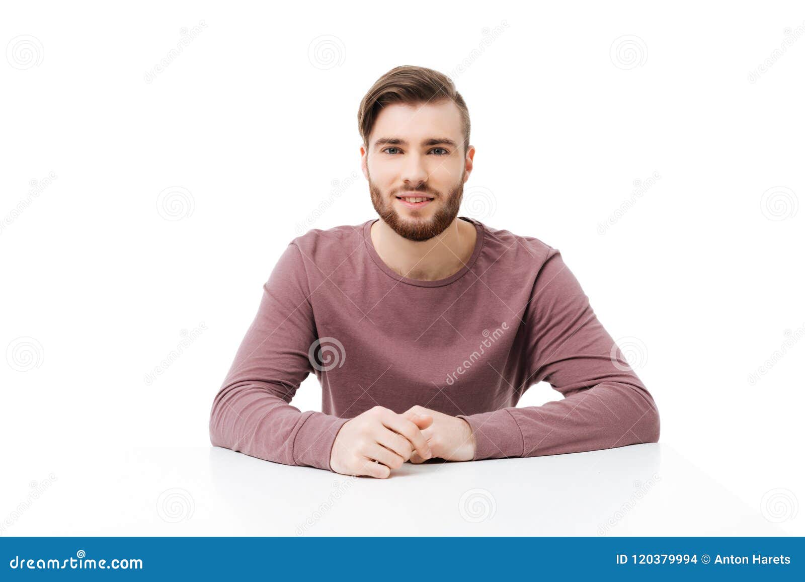 Handsome Young and Friendly Man Looking at the Camera Sitting at the ...