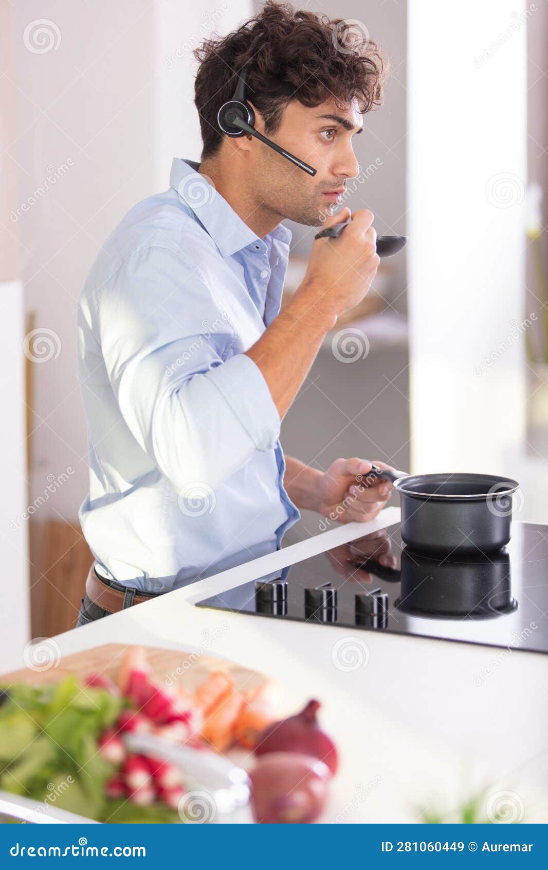 Handsome Young Guy Talking on Mobile Phone and Cooking Stock Image ...