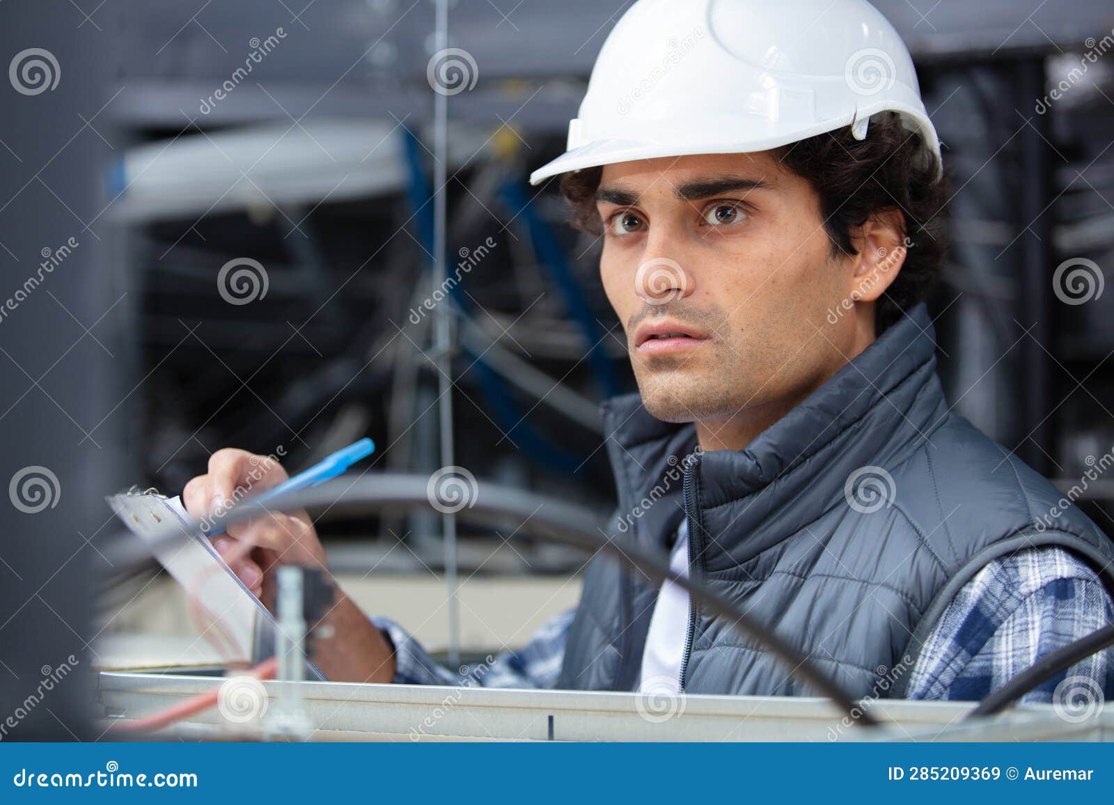Handsome Young Male Builder Writing on Clipboard Stock Image - Image of ...
