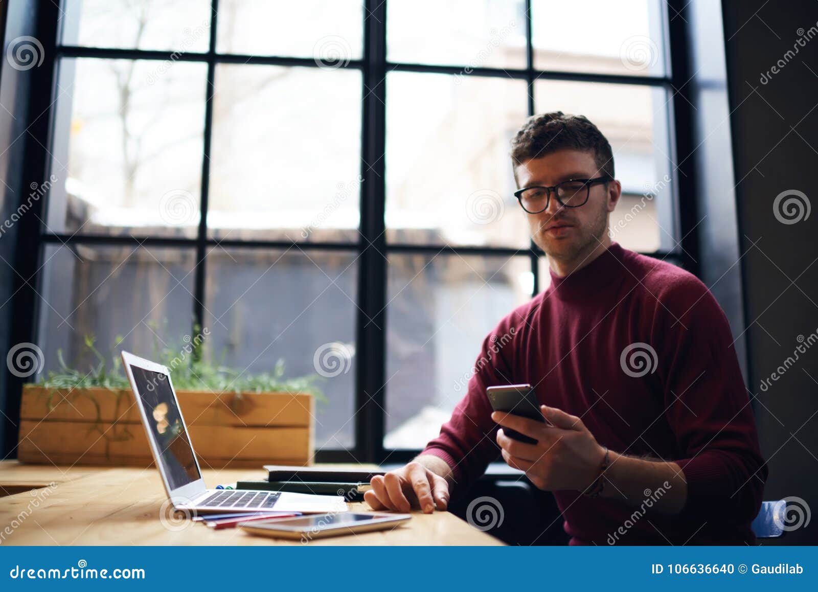 Hipster Guy Using Application on Cellular Indoors Stock Photo - Image ...