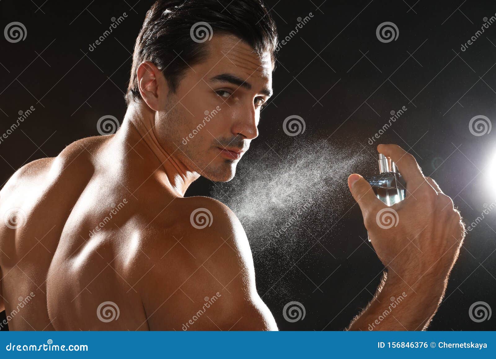 Handsome Young Man Applying Perfume Stock Photo - Image of lifestyle ...