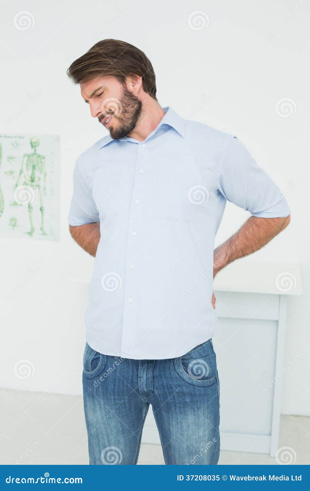 Handsome Young Man with Back Pain Stock Image - Image of indoors, cure ...
