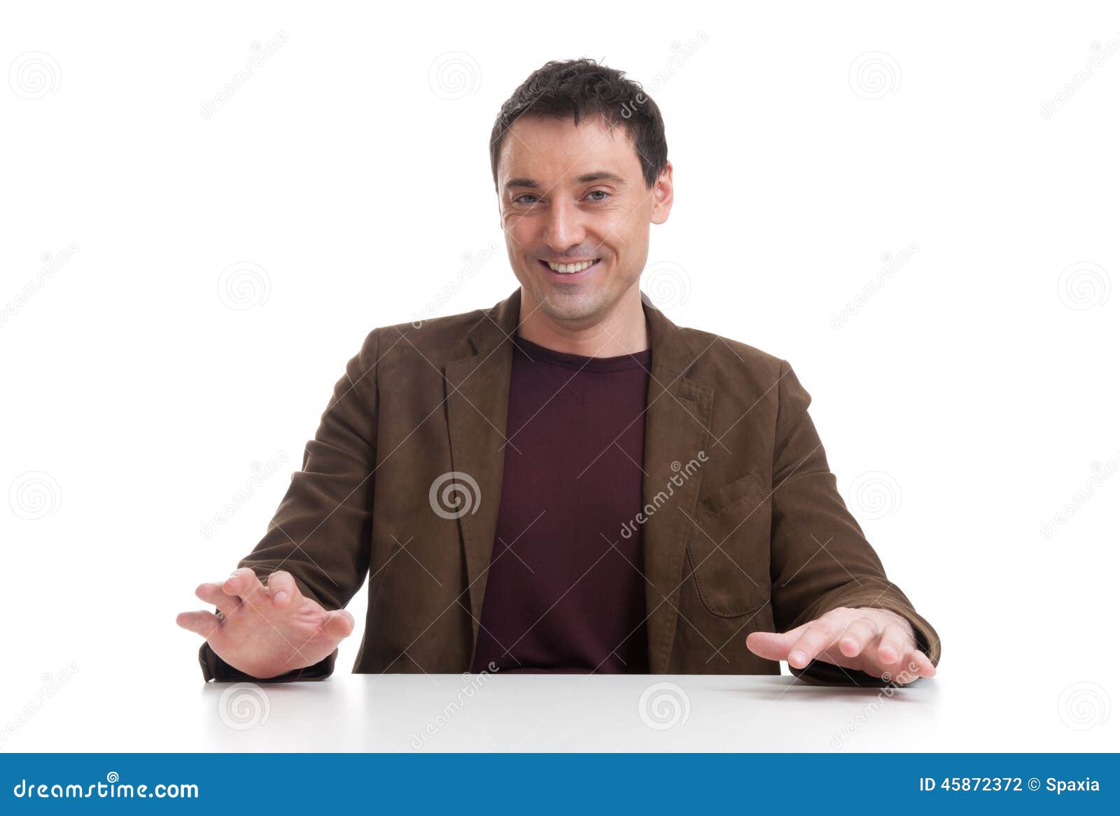 Handsome Young Man Behind Desk Stock Photo - Image of glamour, sitting ...