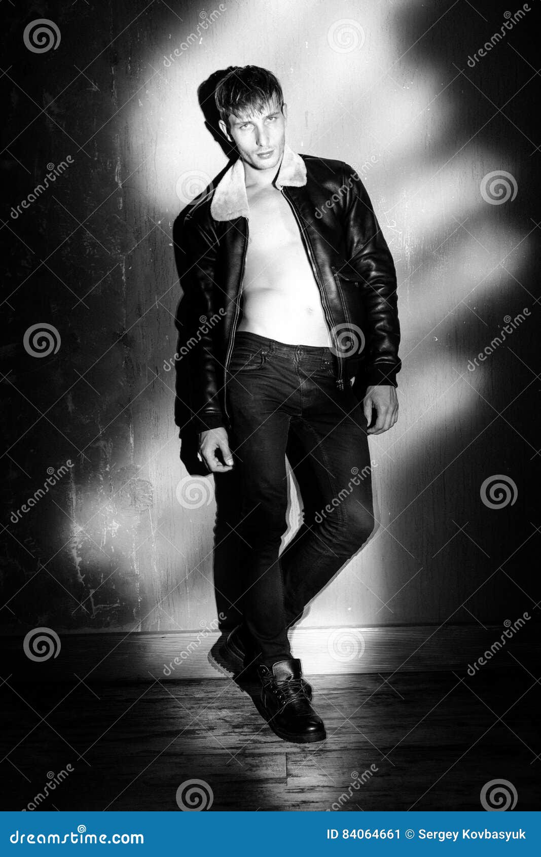 Handsome Young Man in Black Jacket Posing in Studio Stock Image - Image ...