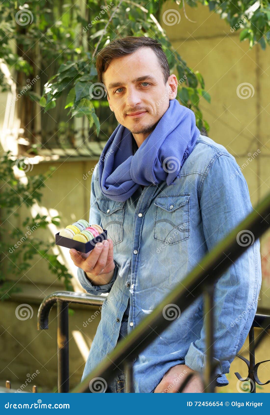 Handsome Young Man with a Box of Macaroons Stock Photo - Image of arms ...