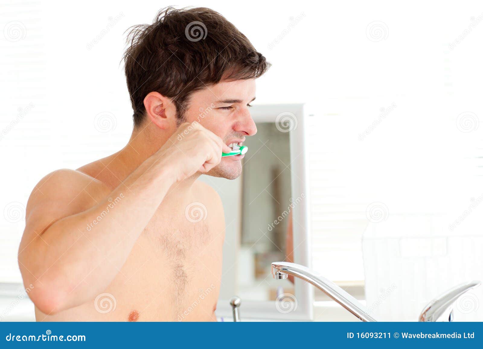 Handsome Young Man Brushing His Teeth in Bathroom Stock Image - Image ...