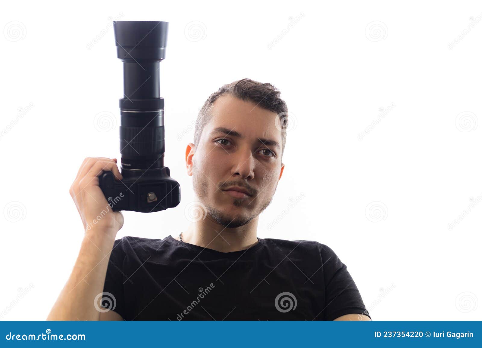 Handsome Young Man with a Camera, Selective Focus on the Eyes. Portrait ...