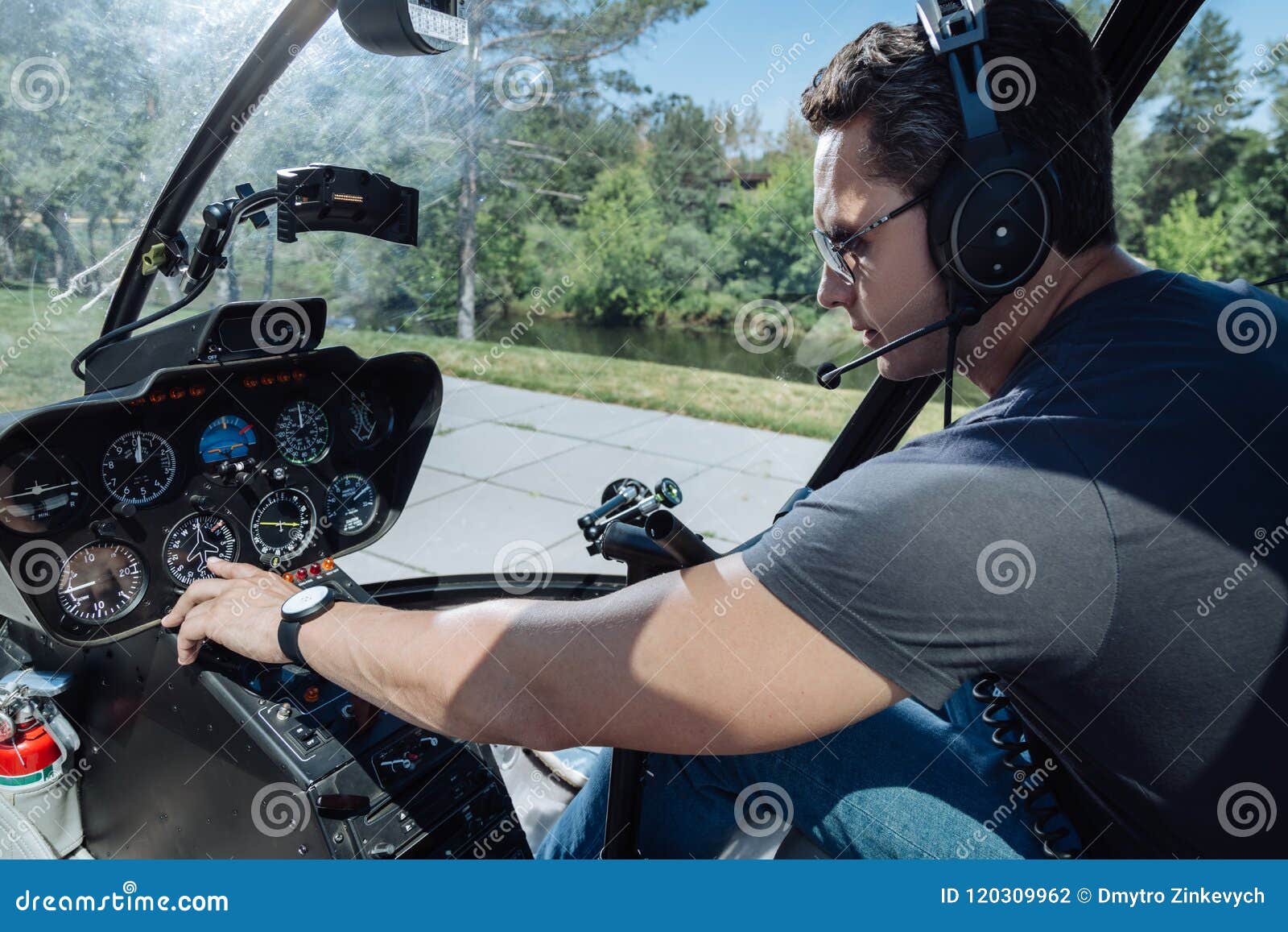Handsome Young Man Checking Helicopter Dashboard Stock Photo - Image of ...