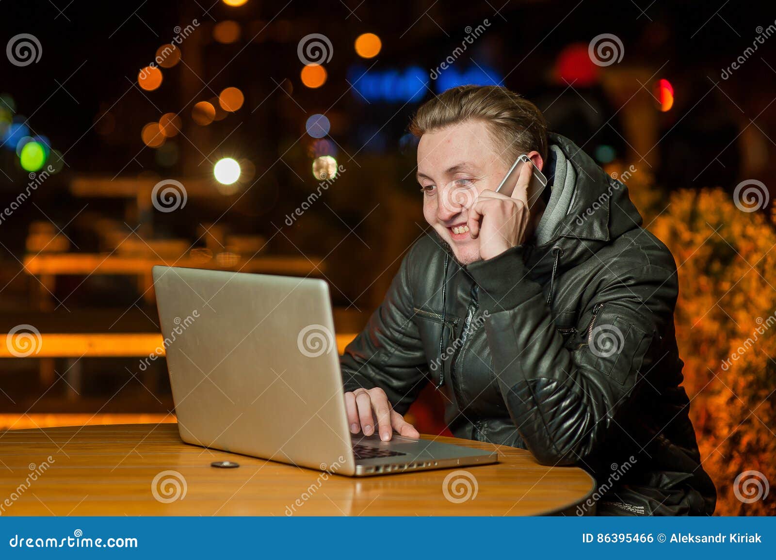 Handsome Young Man with a Computer on the Street Stock Photo - Image of ...