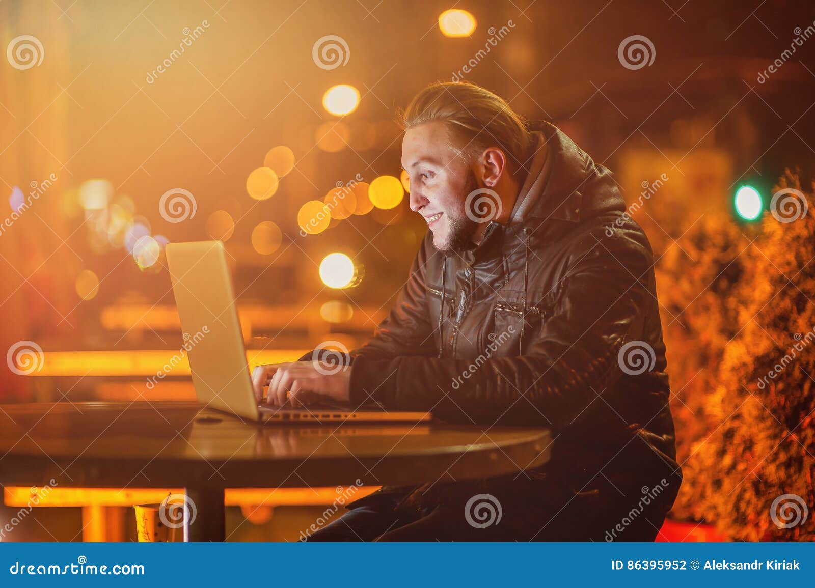 Handsome Young Man with a Computer on the Street Stock Photo - Image of ...