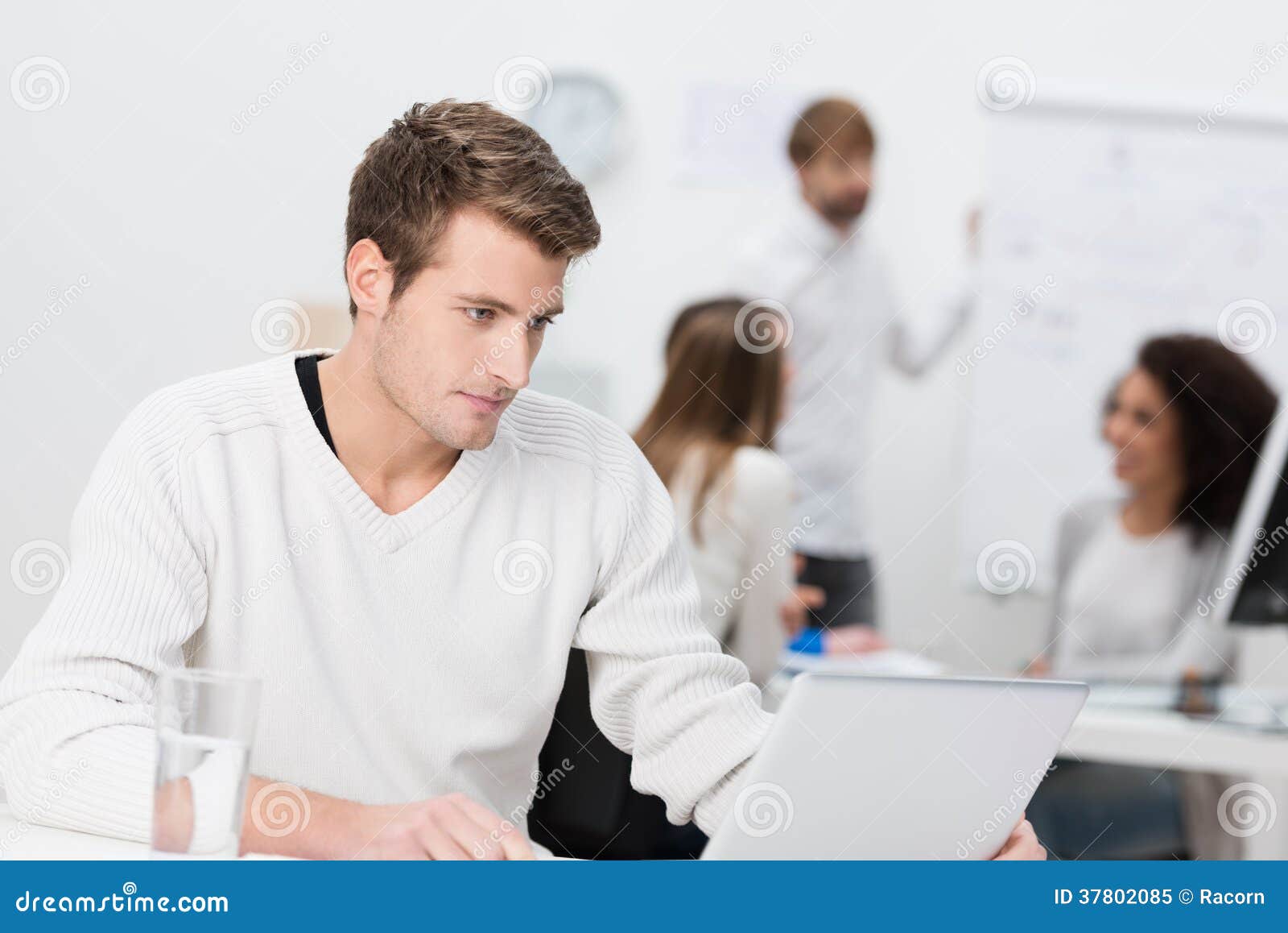 Handsome Young Man Concentrating on His Work Stock Image - Image of ...