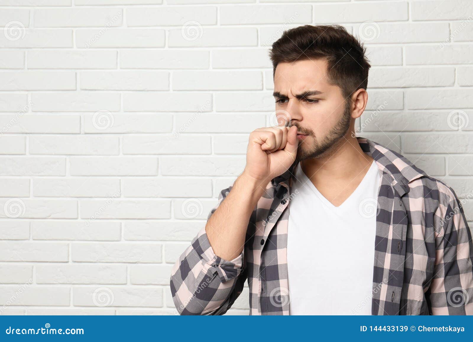 Handsome Young Man Coughing Near Wall. Space for Text Stock Image ...