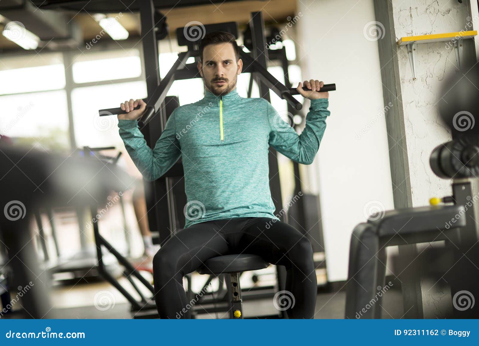 Young Man Doing Exercise for Triceps in the Gym Stock Photo - Image of ...