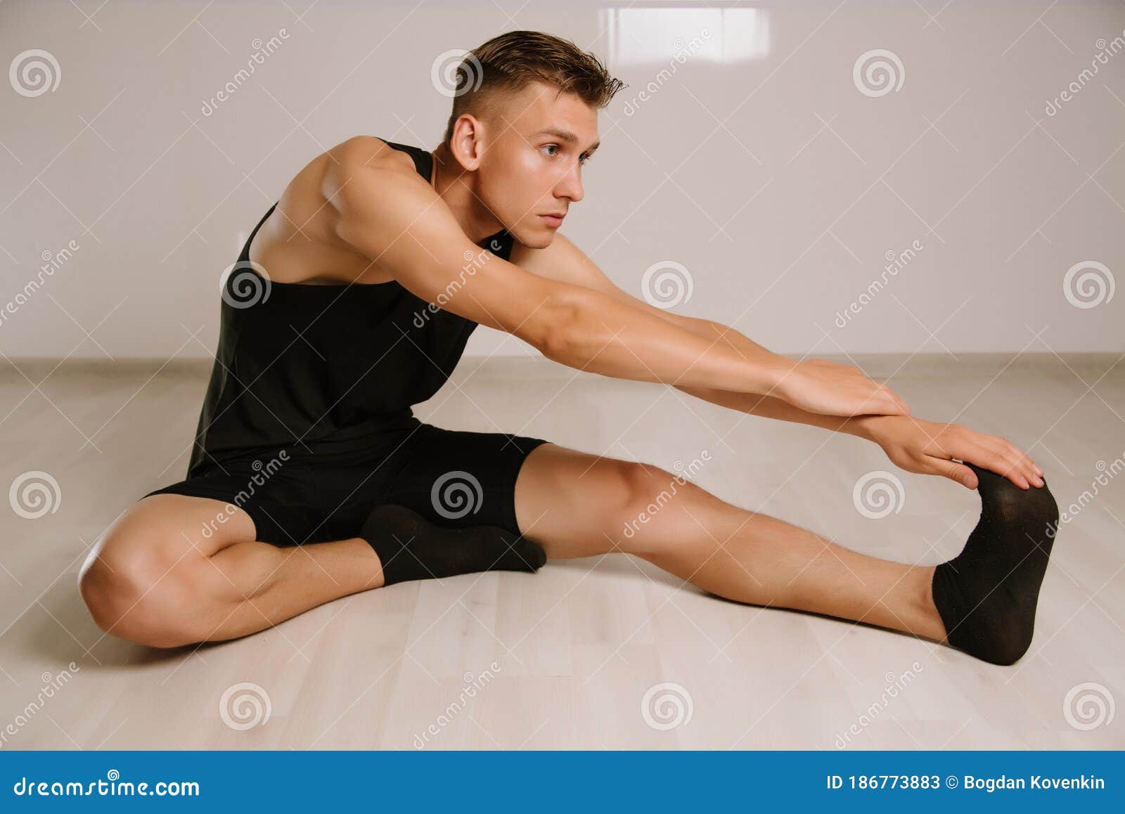Handsome Young Man Doing Hamstring Stretch Exercise at Home Stock Image ...
