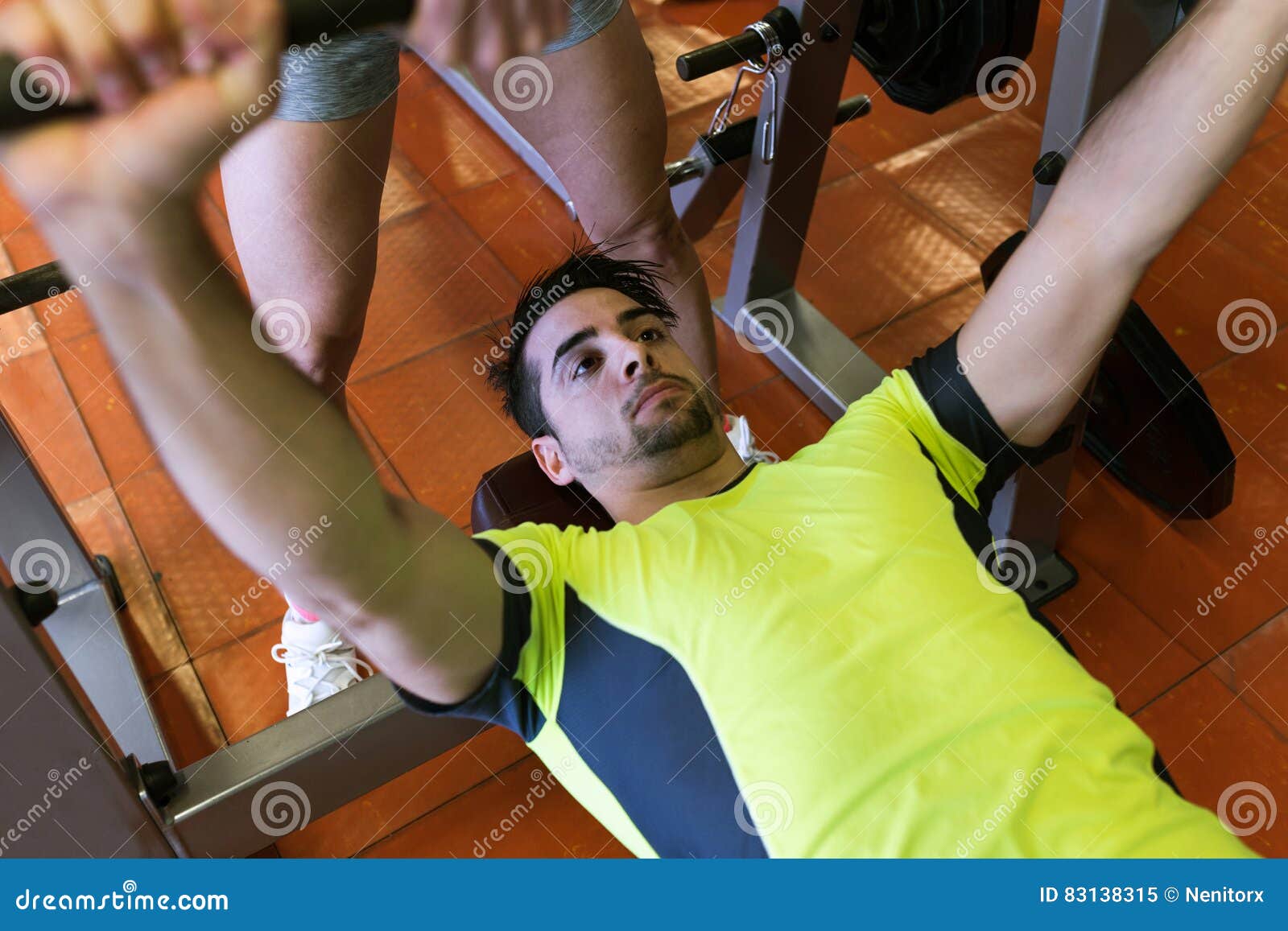 Handsome Young Man Doing Muscular Exercise in Gym. Stock Image - Image ...