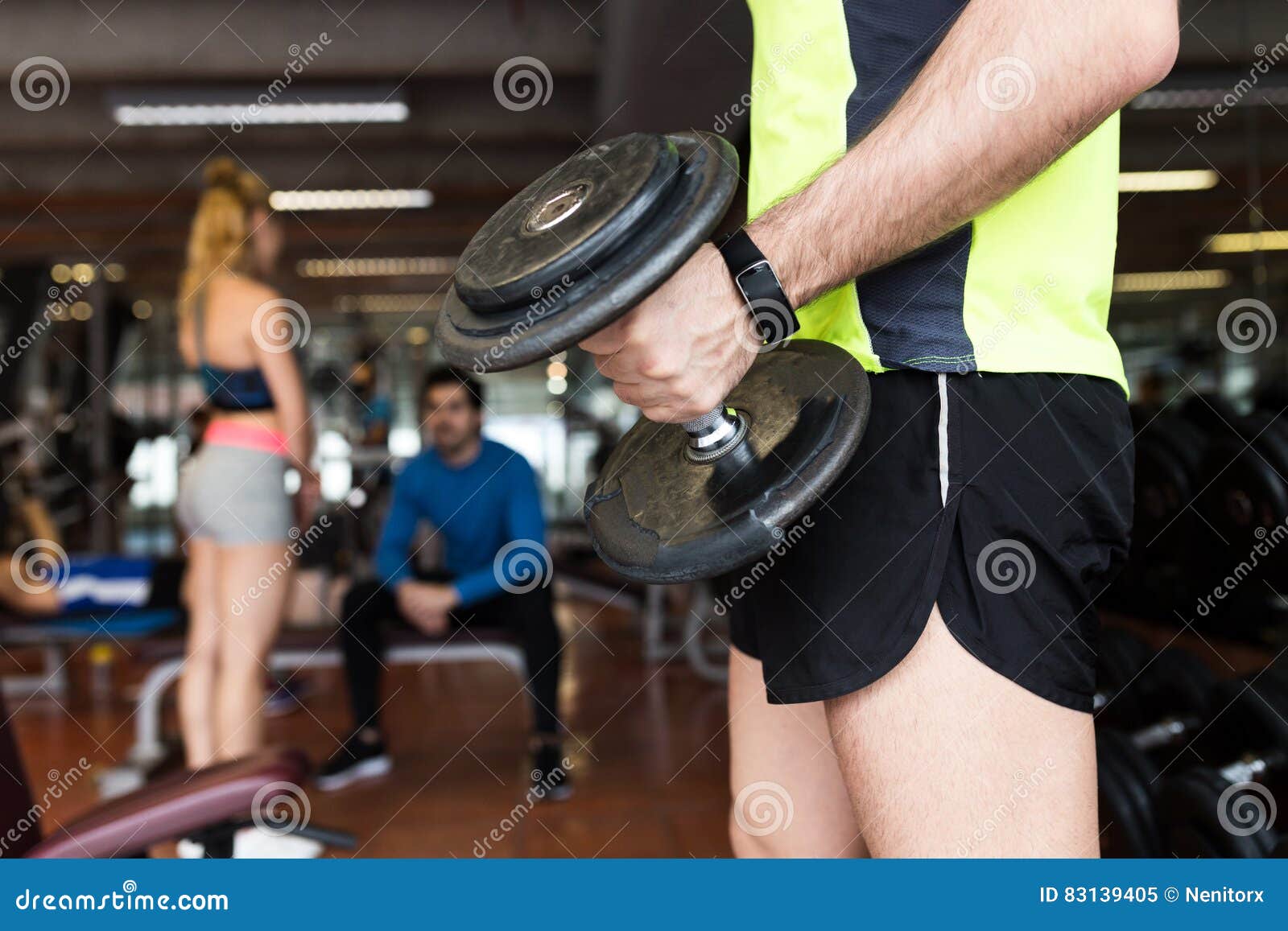 Handsome Young Man Doing Muscular Exercise in Gym. Stock Image - Image ...