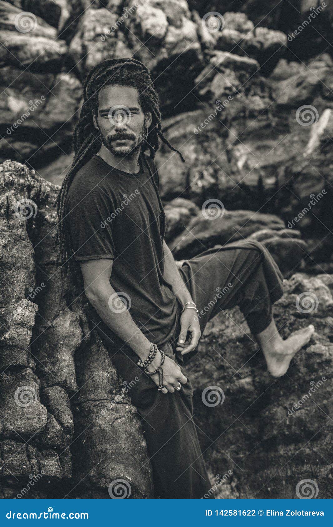 Handsome Young Man With Dreadlocks Outdoors Male Model At The Rocks