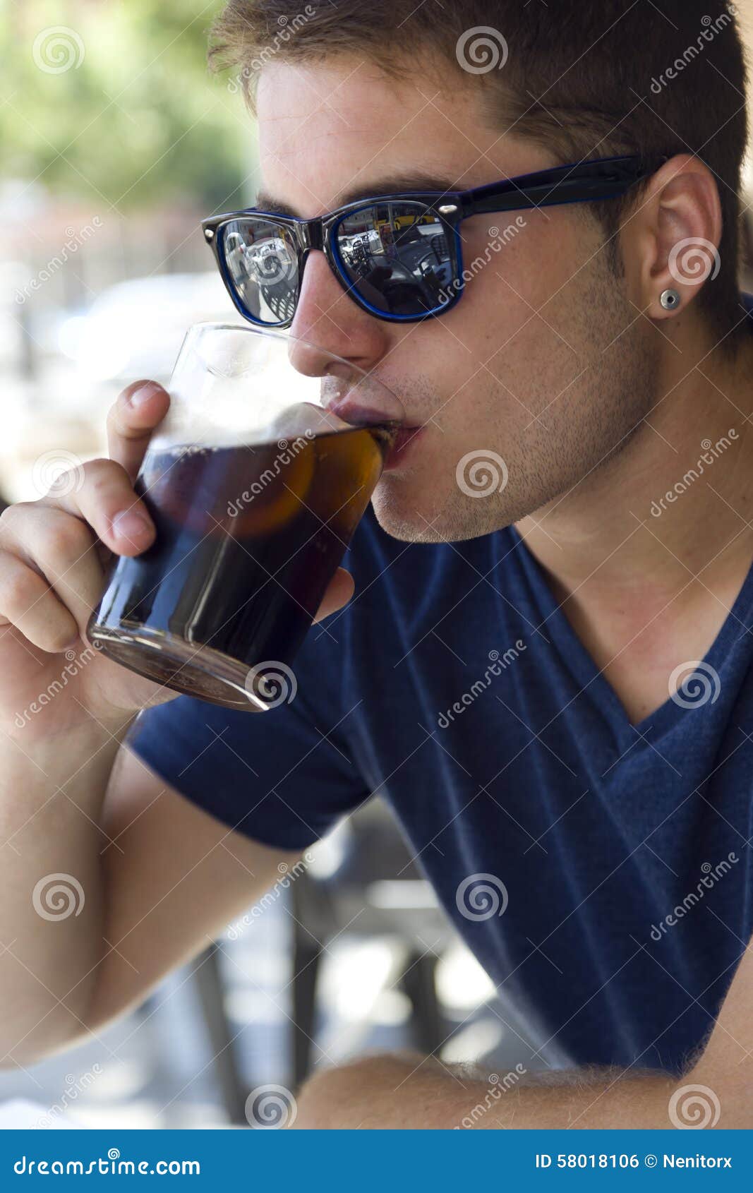 Handsome Young Man Drinking Refreshment in the Street. Stock Photo ...