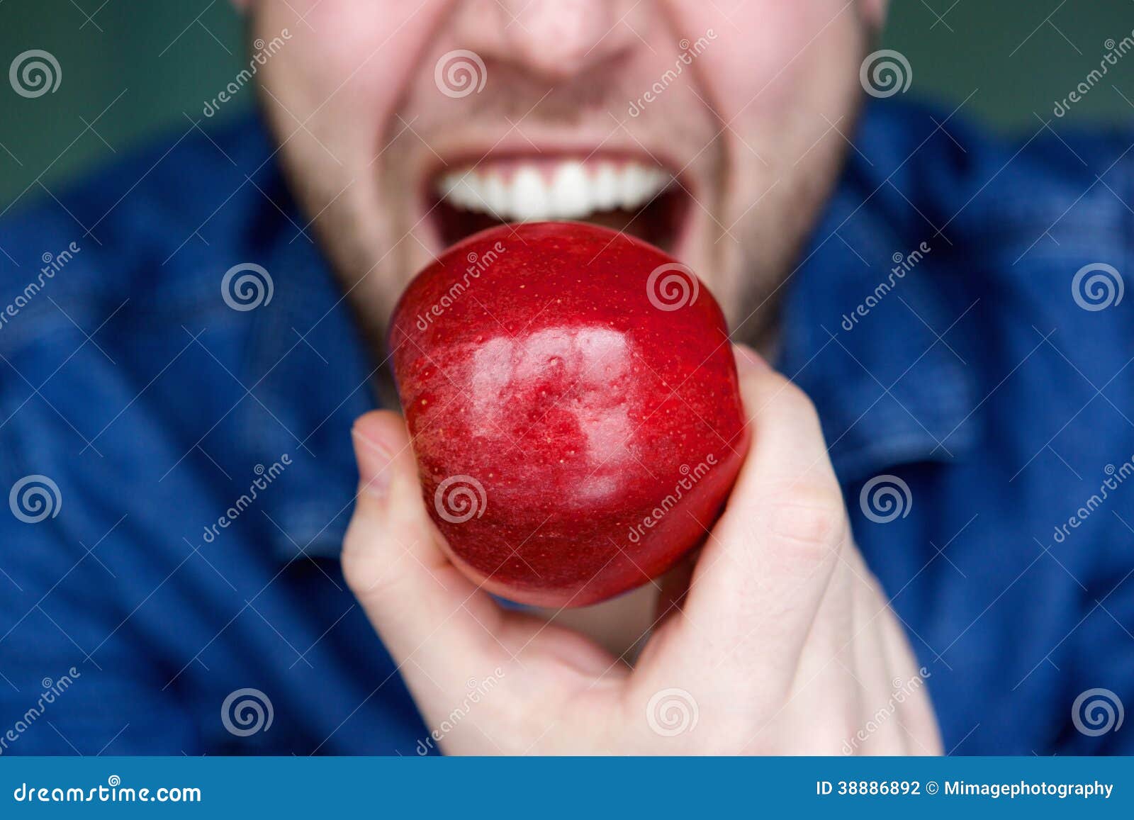 Handsome Young Man Eating Red Apple Stock Photo - Image of lunch, diet ...