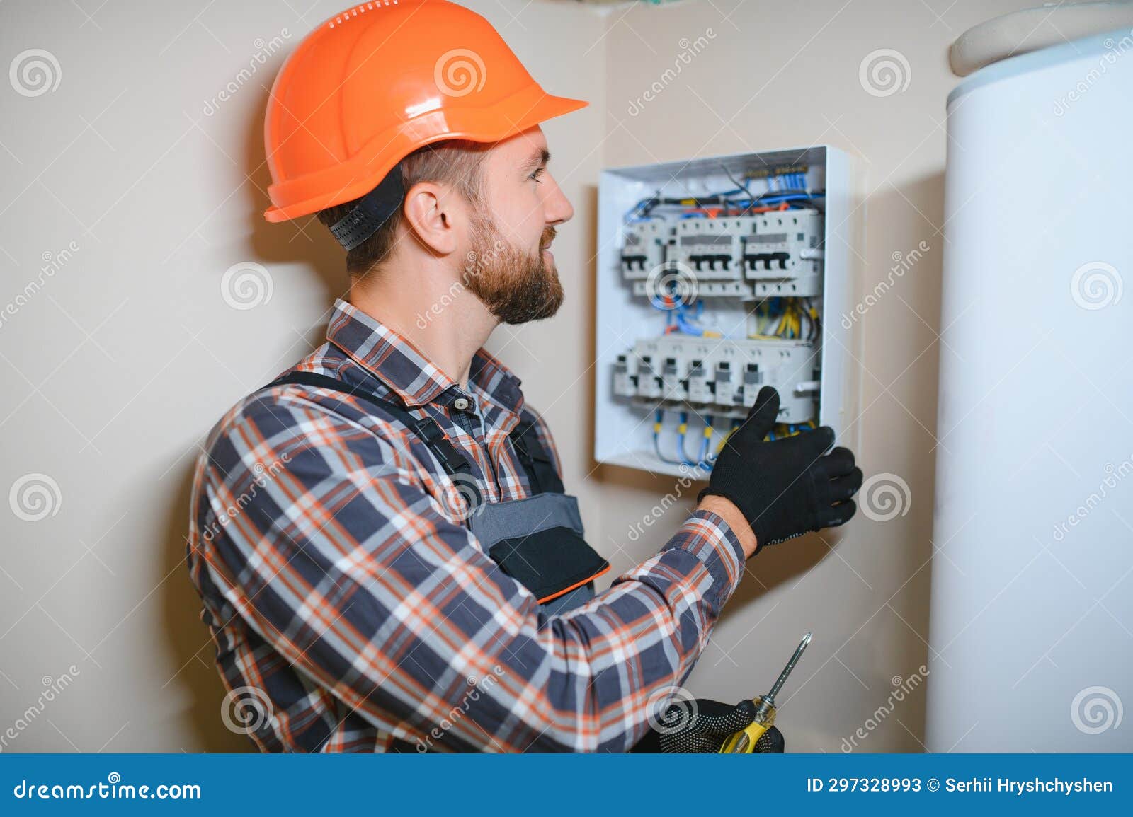 Handsome Young Man Electrician Working on Switchboard of House Building ...