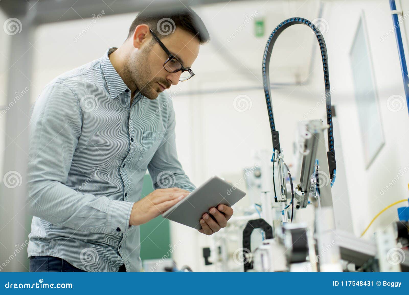 Handsome Young Man in the Electronic Workshop Holding Digital Ta Stock ...