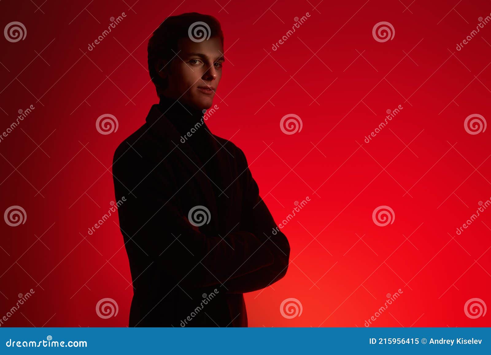 Young man in red light stock image. Image of handsome - 215956415