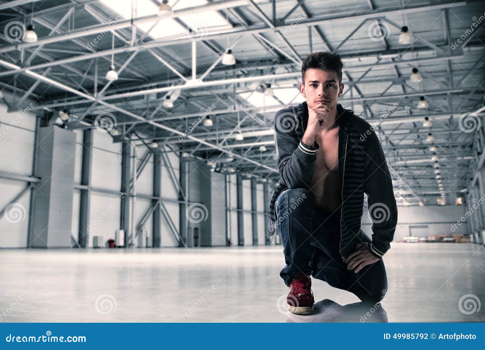 Handsome Young Man in Empty Warehouse Stock Photo - Image of adult ...