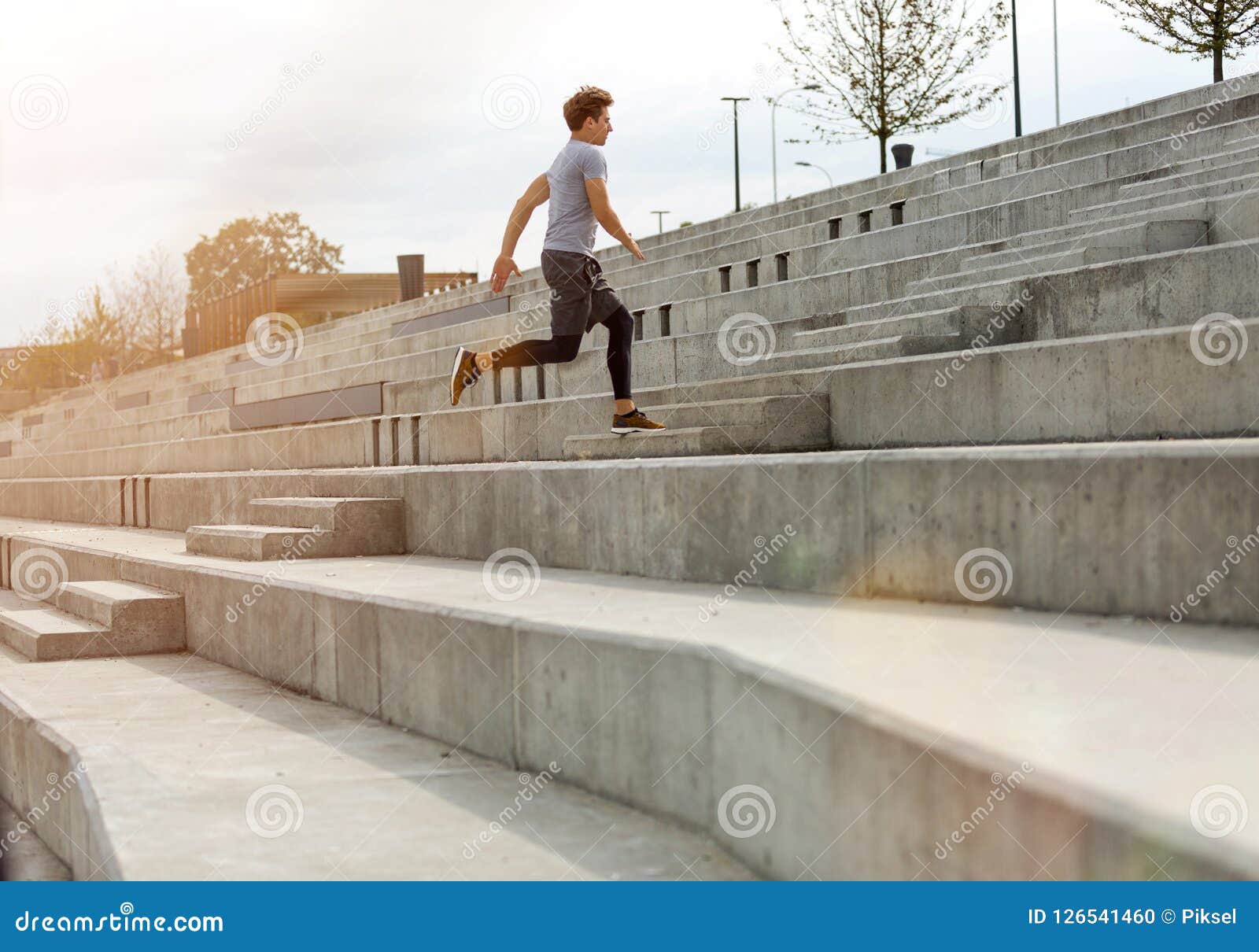 Man running in urban area stock photo. Image of action - 126541460