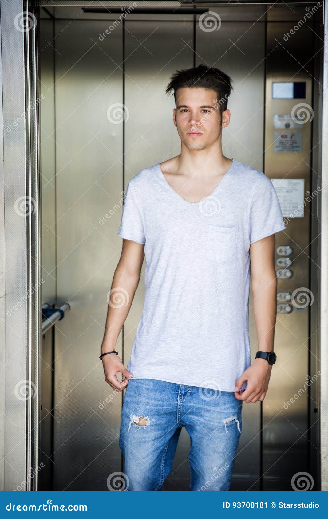 Handsome Young Man Getting Out of Elevator or Lift Stock Image - Image ...