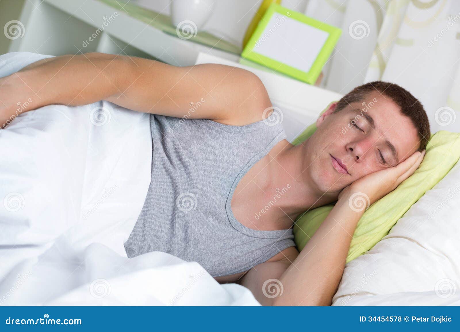 Handsome Young Man Happily Sleeping in Bed Stock Photo - Image of ...