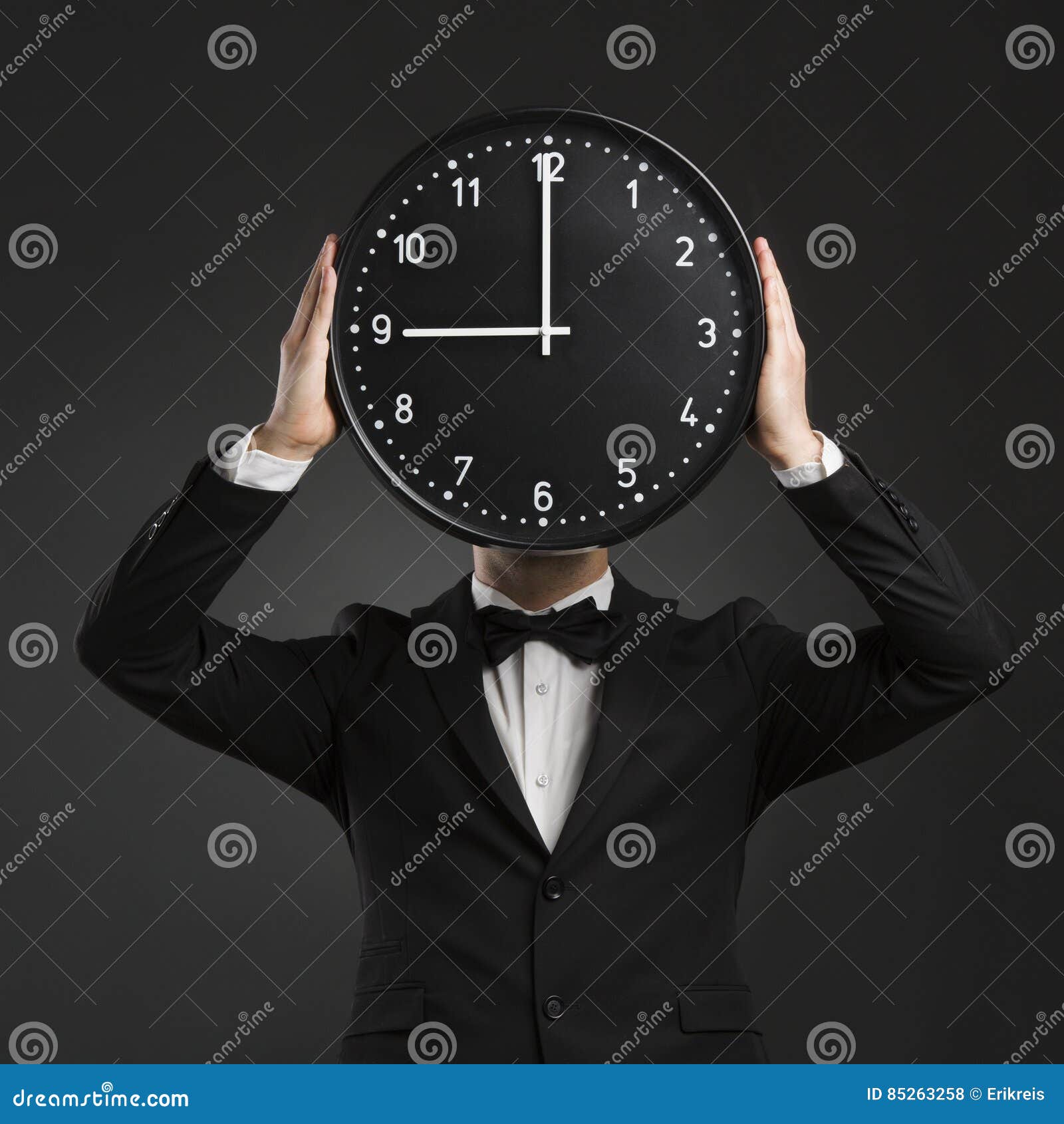 Handsome Young Man Holding a Clock Stock Photo - Image of executive ...