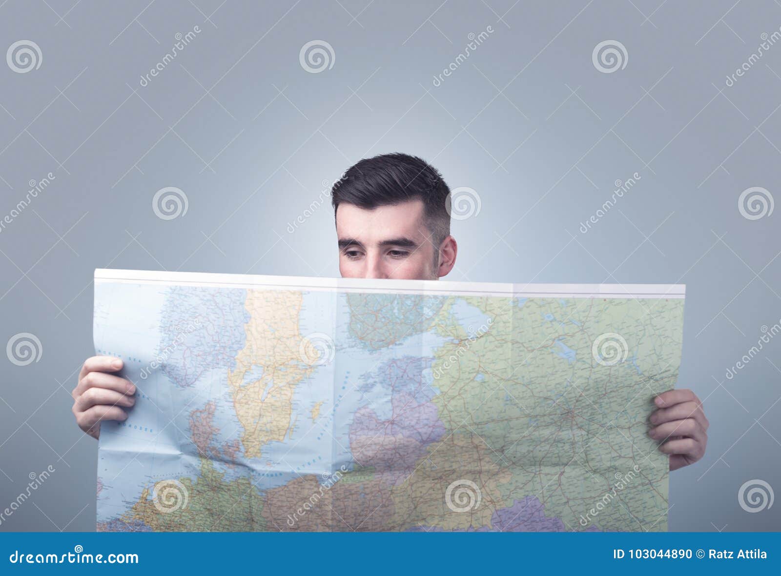 Young man holding map stock photo. Image of male, hobby - 103044890