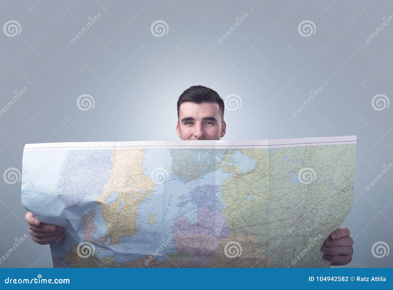 Young man holding map stock photo. Image of adult, lifestyle - 104942582