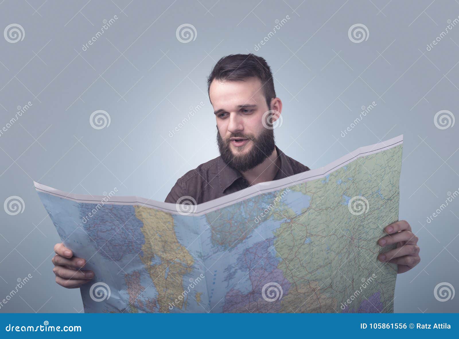 Young man holding map stock photo. Image of hobby, direction - 105861556