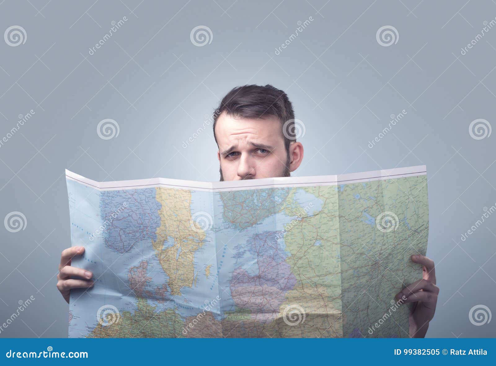 Young man holding map stock image. Image of leisure, hike - 99382505