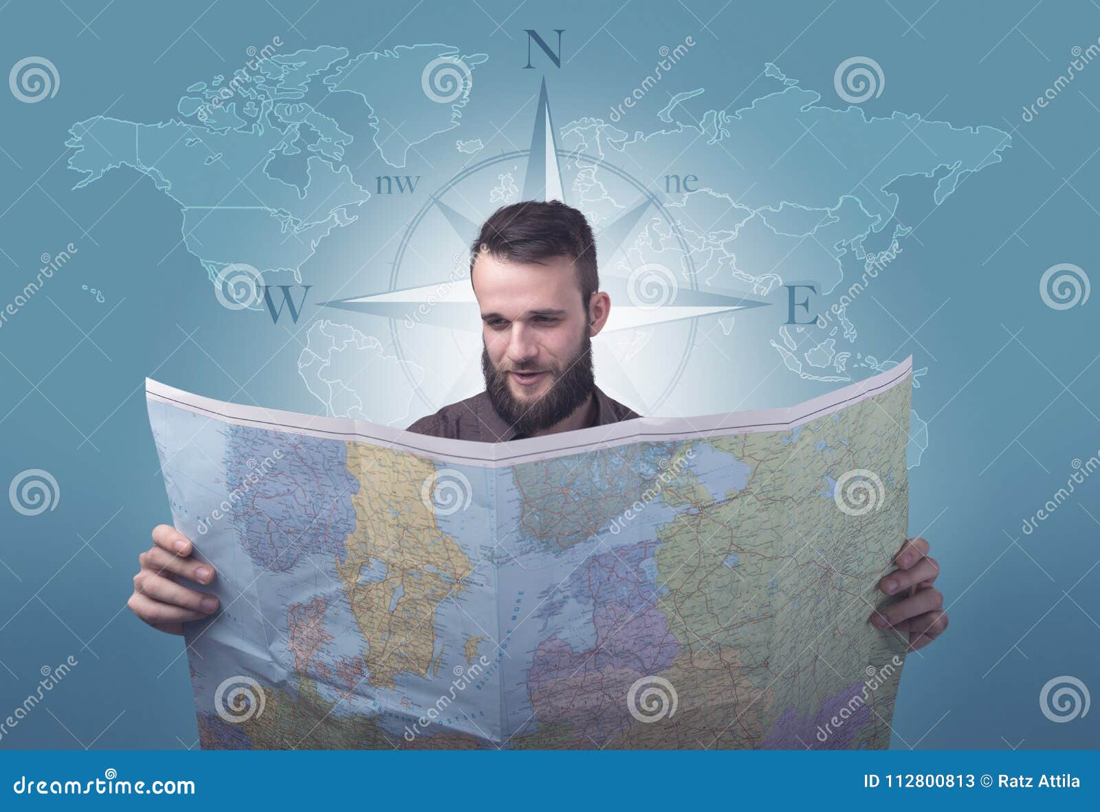 Young man holding map stock image. Image of blue, navigation - 112800813