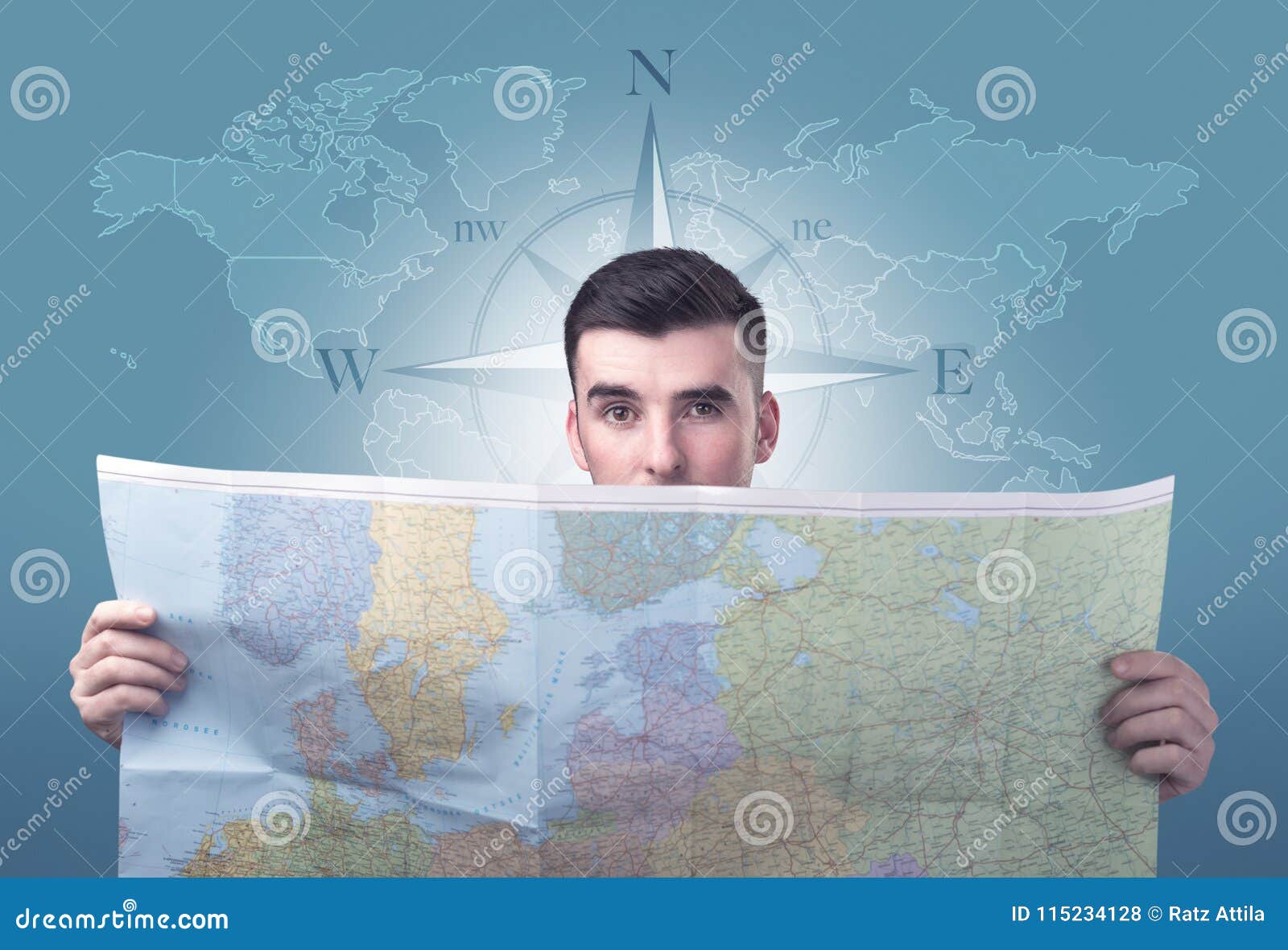 Young man holding map stock photo. Image of background - 115234128
