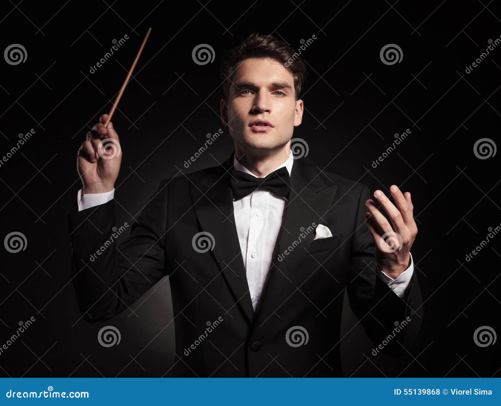 Handsome Young Man Holding a Stick in His Hand Stock Photo - Image of ...
