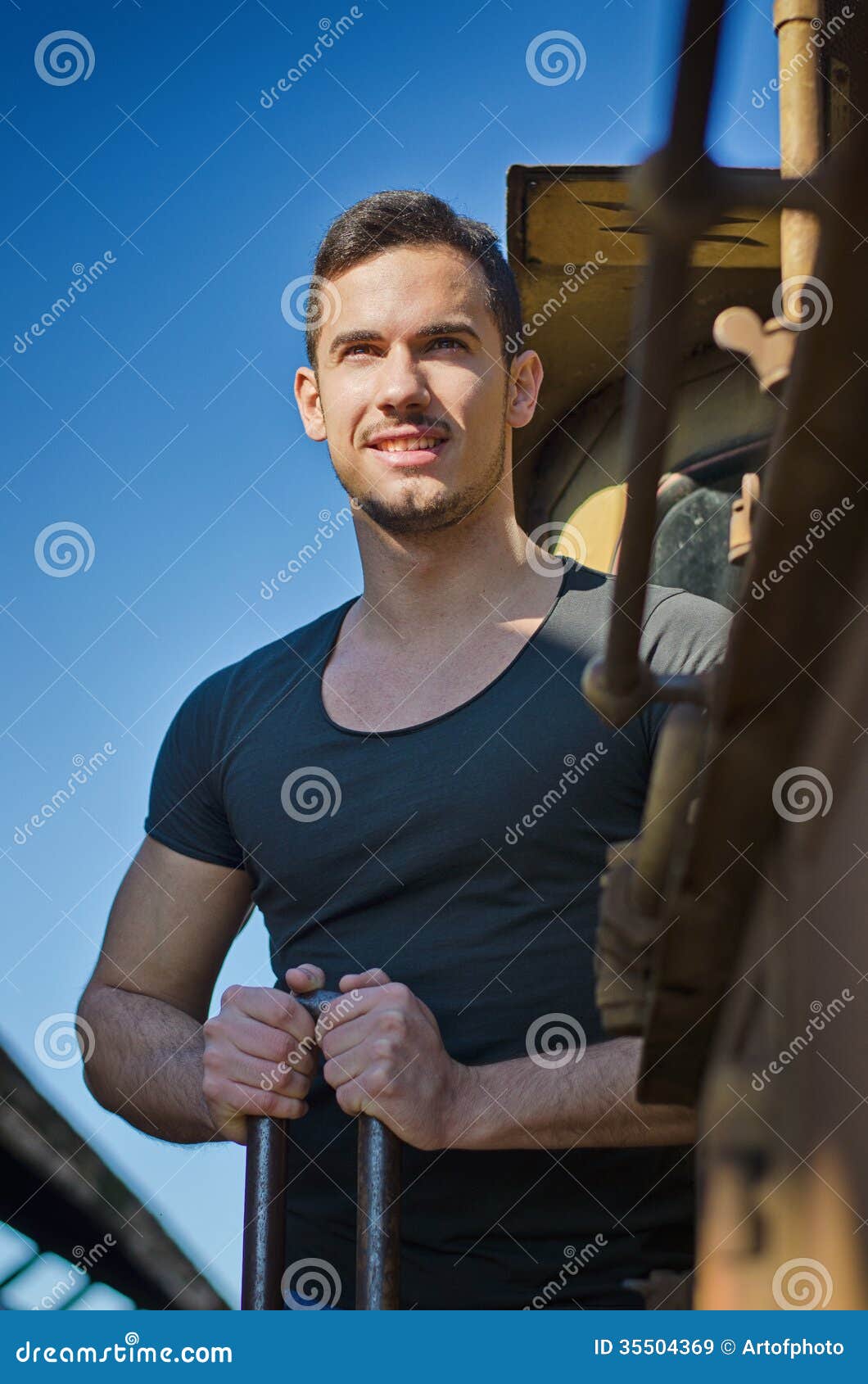 Handsome Young Man Holding from Train Handle Stock Image - Image of ...