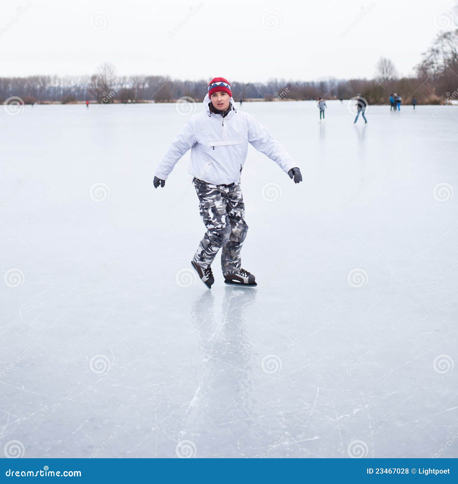 Handsome Young Man Ice Skating Outdoors on a Pond Stock Photo - Image ...