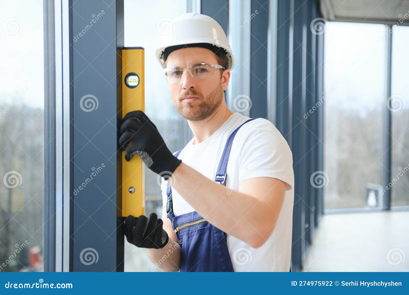 Handsome Young Man Installing Bay Window in New House Construction Site ...