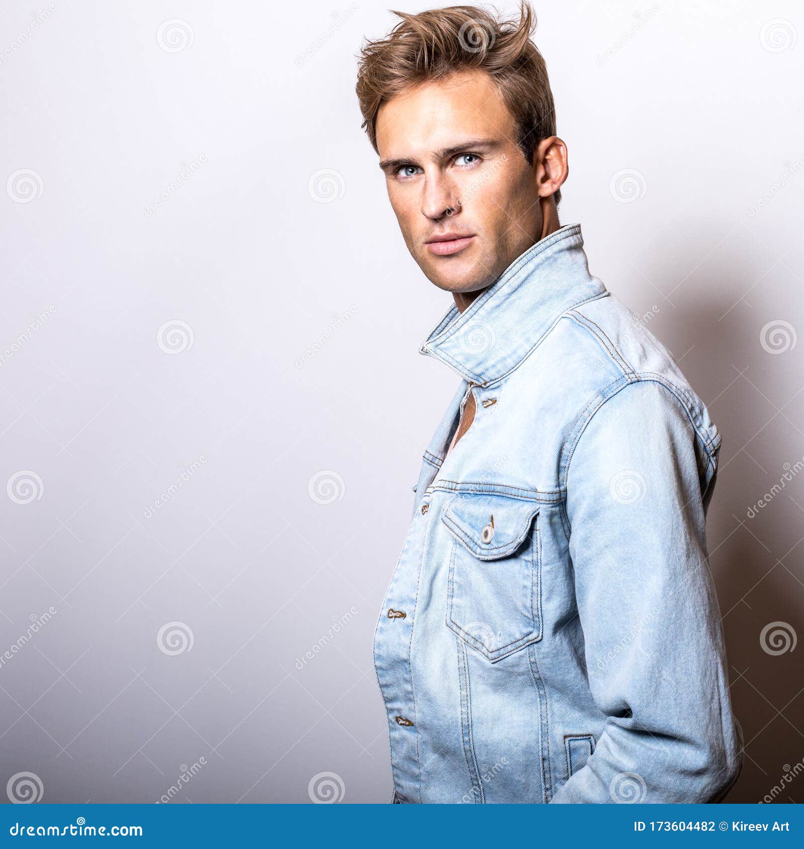 Handsome Young Man in Jeans Jacket Pose in Studio. Stock Photo - Image ...