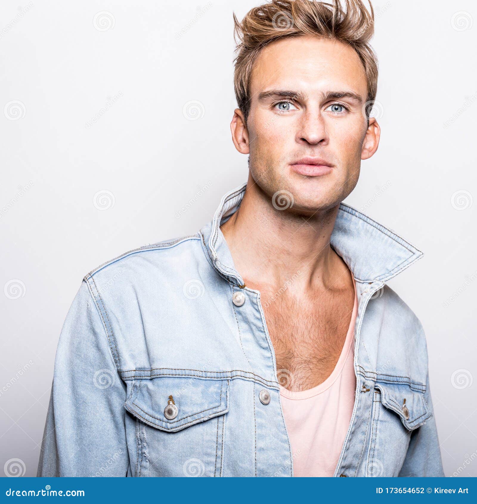 Handsome Young Man in Jeans Jacket Pose in Studio. Stock Photo - Image ...